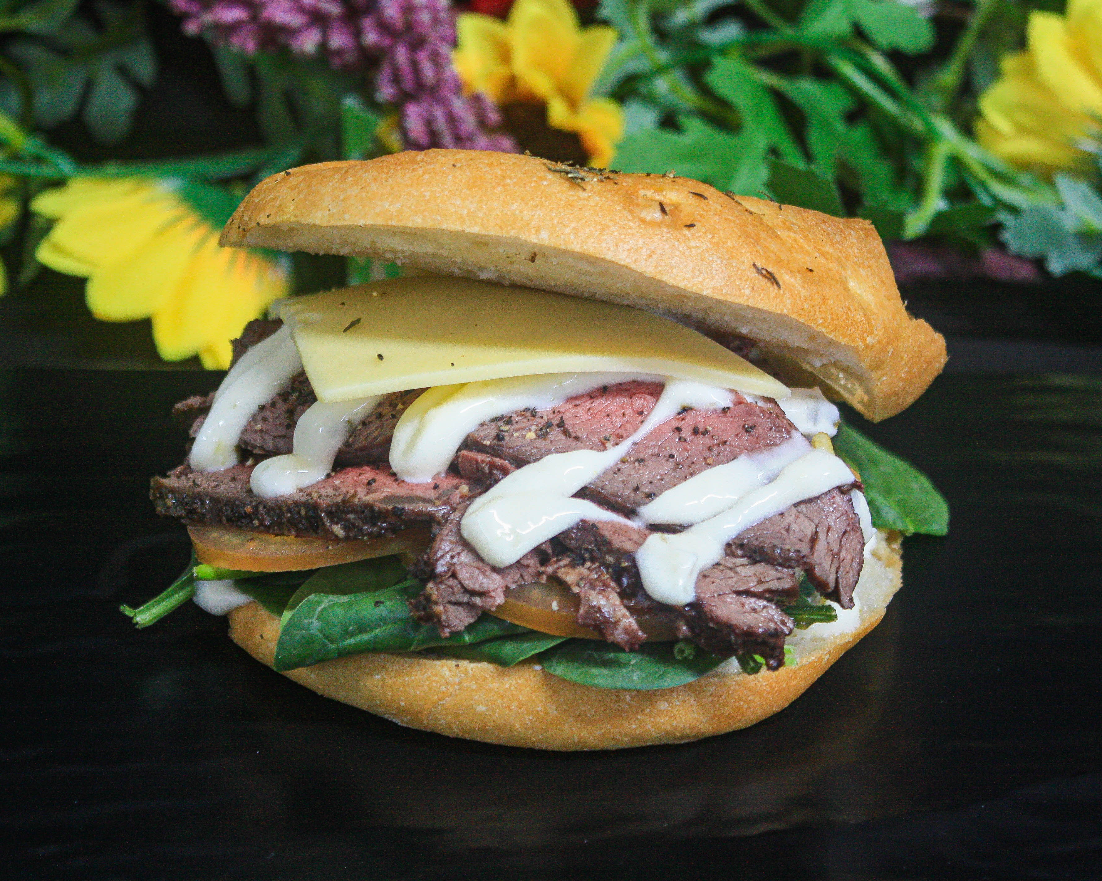 Turkish bap – Peppered beef, Swiss cheese, tomato, baby spinach, pickle ...